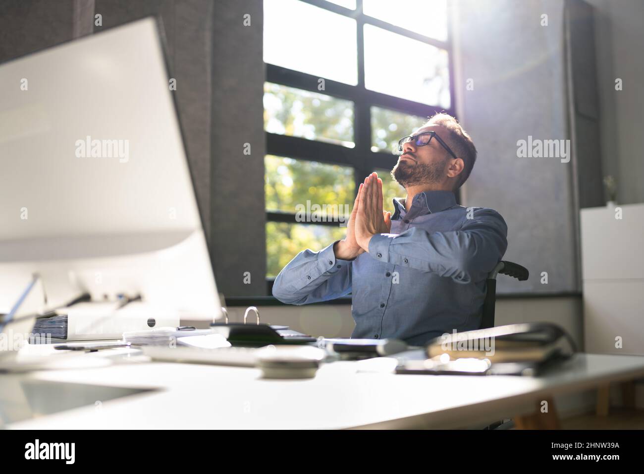 Religious young businessman praying hi-res stock photography and images ...