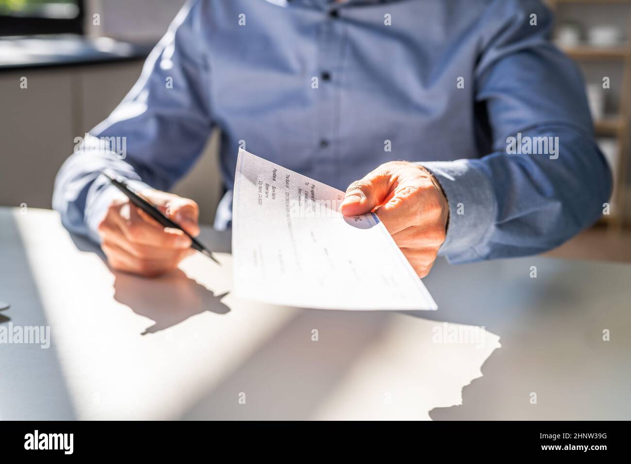 Stimulus Check And PPP Loan Payment Cheque In Hand Stock Photo - Alamy