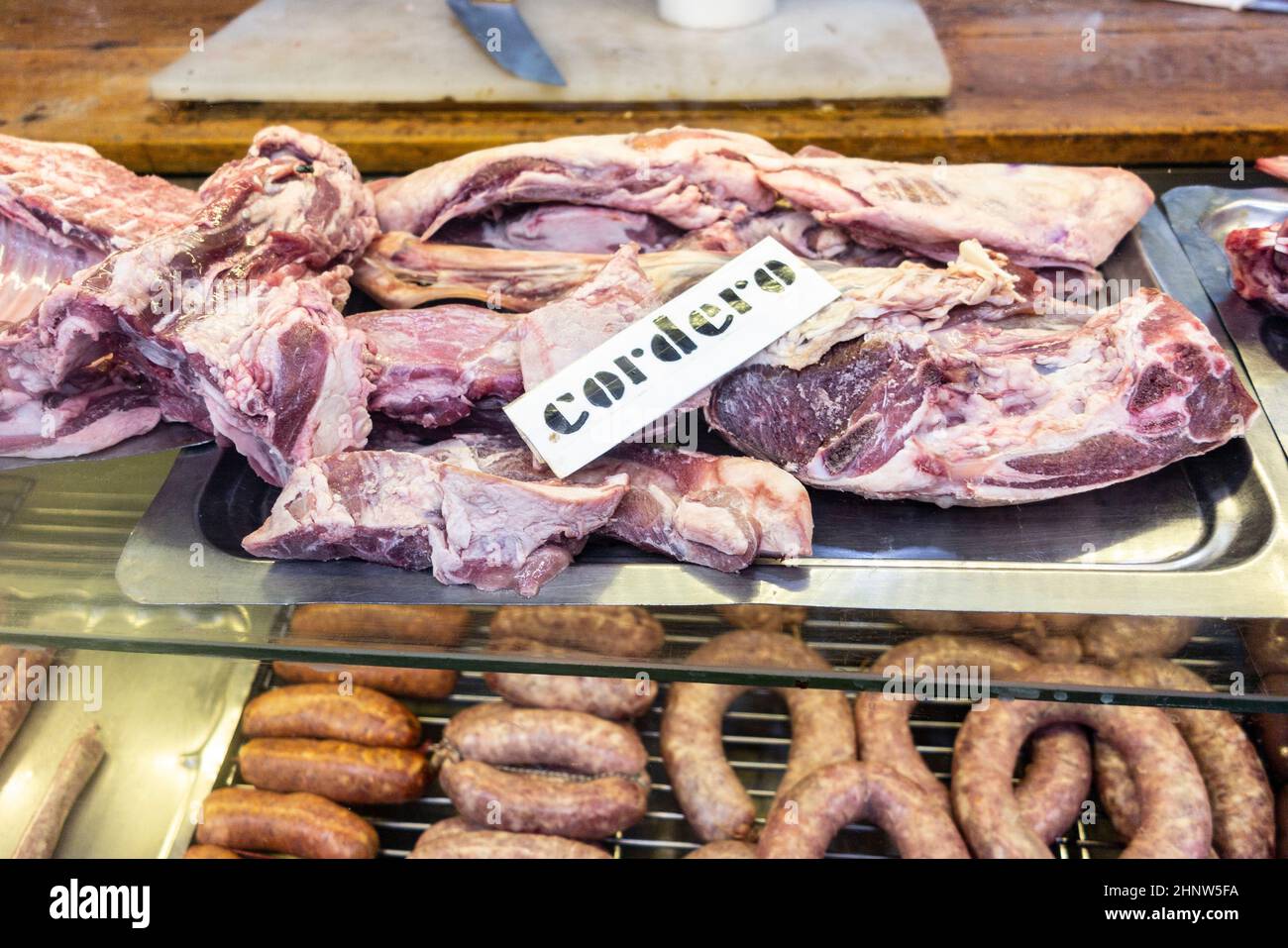lamb at a butchers ahop mith the spanish word for lamb, cordero ...