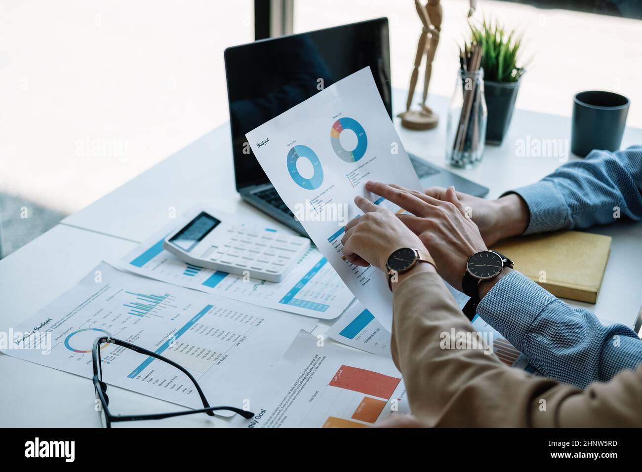 Two accountant discussion analysis sharing calculations about the ...