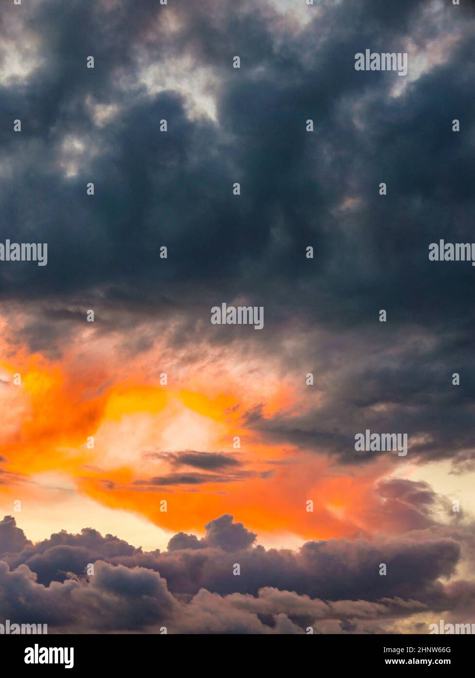 dramatic sky with harmonic sunset and dark rainy clouds Stock Photo - Alamy