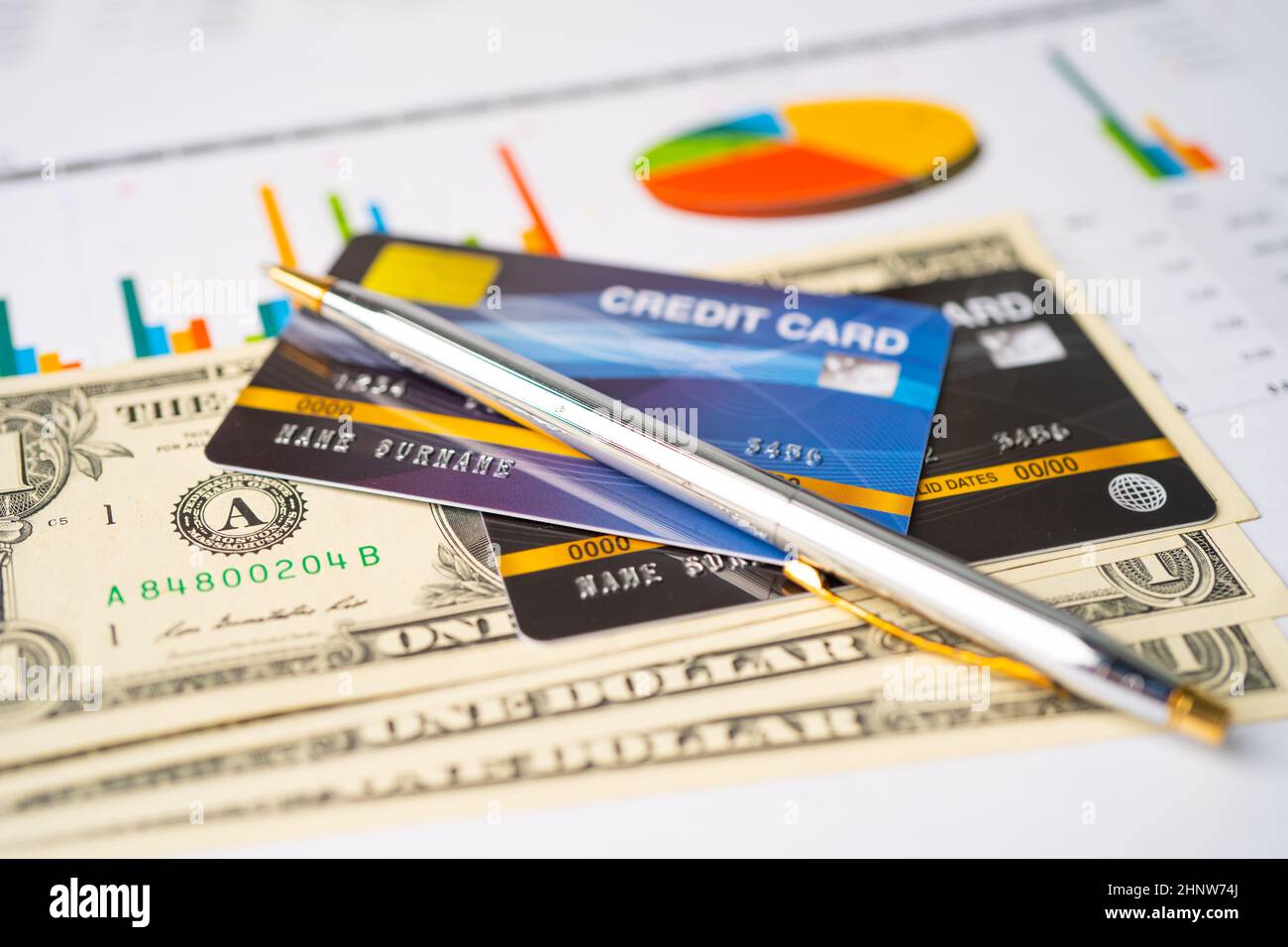 Credit card on chart and graph paper. Finance development, Banking ...