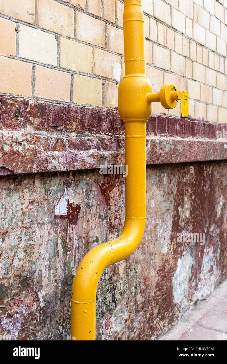 yellow gas pipe on wall of urban apartment house Stock Photo - Alamy