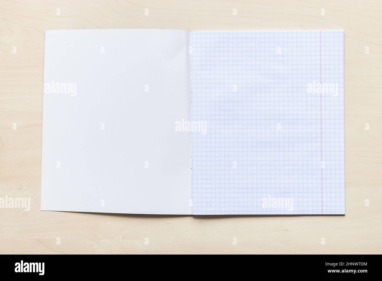 top view of blank first page of open school notebook with squared ...