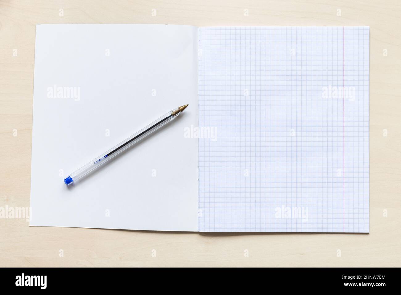 top view of pen and blank first page of open school notebook with ...
