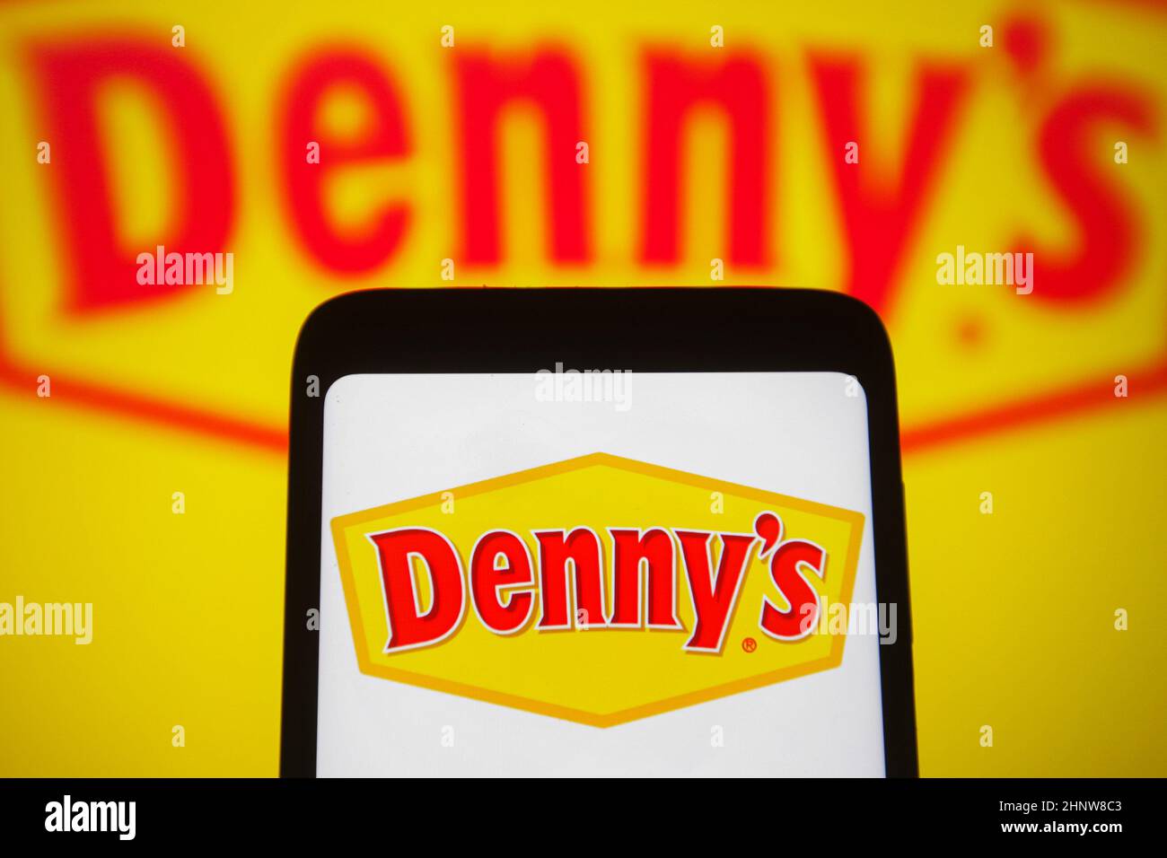 In this photo illustration, a Denny's (Denny's Diner) logo is seen on a ...
