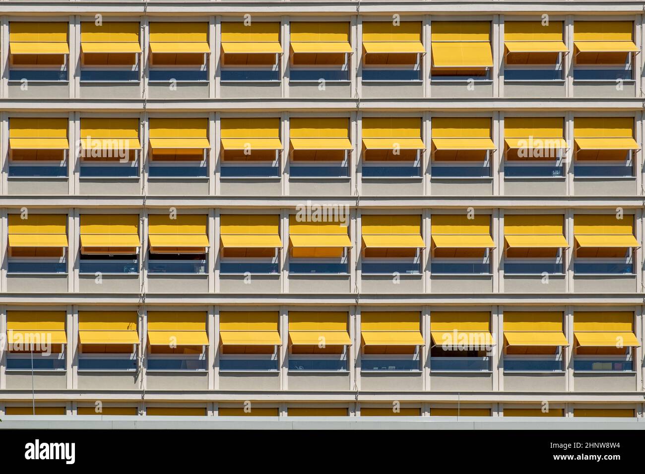 pattern of orange shutter sun protection at a facade of a modern ...