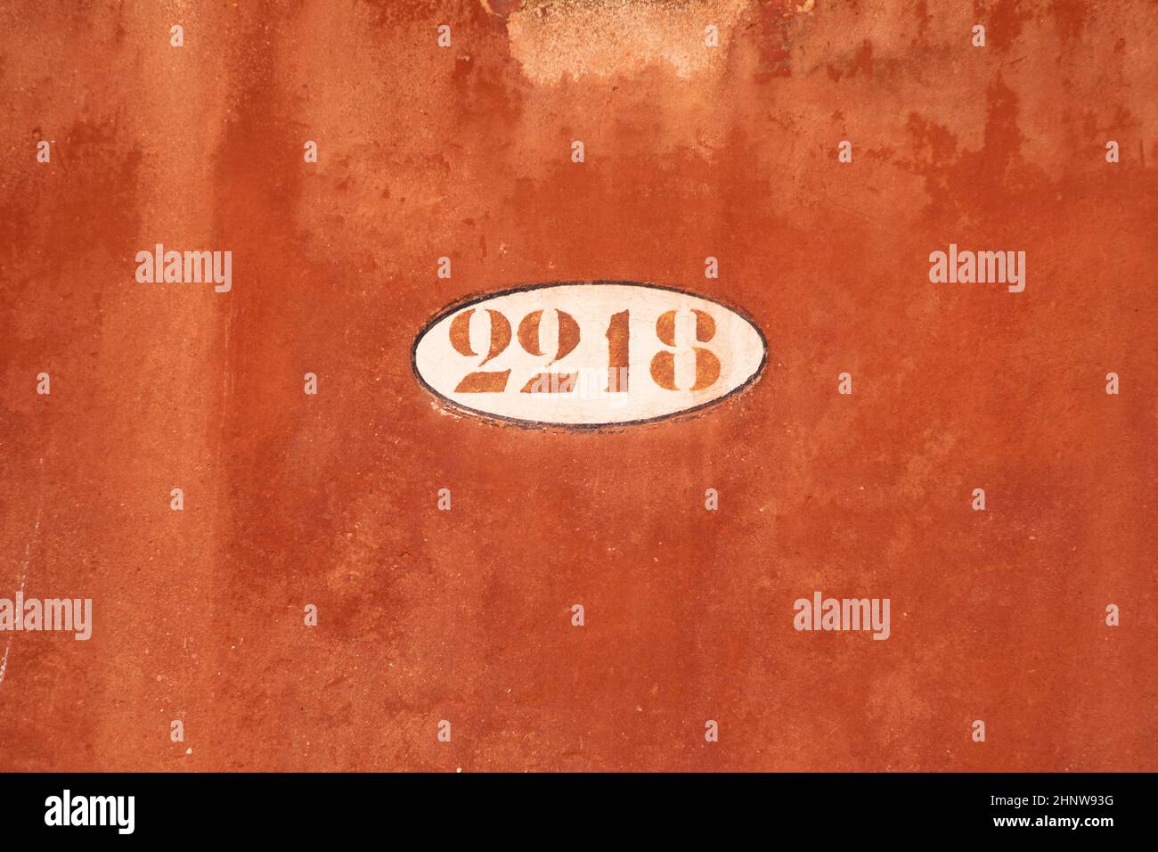 house number 2218 painted at a wall in orange in Venice Stock Photo - Alamy