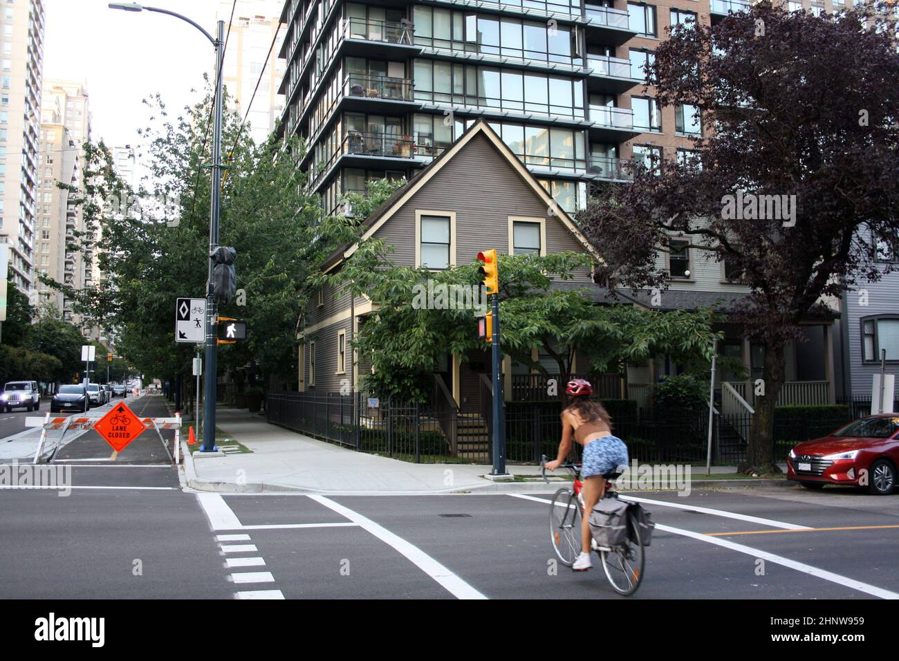 Young woman riding a bike in the street Stock Photo - Alamy