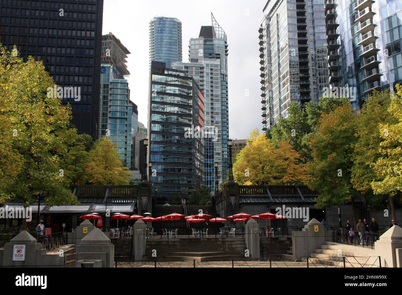 Yellow and green autumn trees and tall buildings in downtown Vancouver ...