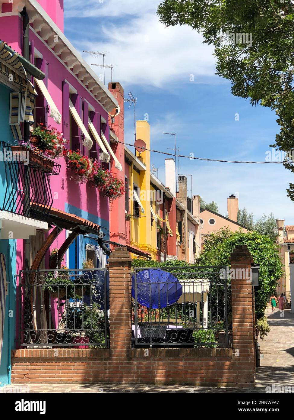 scenic narrow colorful houses at the venetian island of Burano, Italy ...