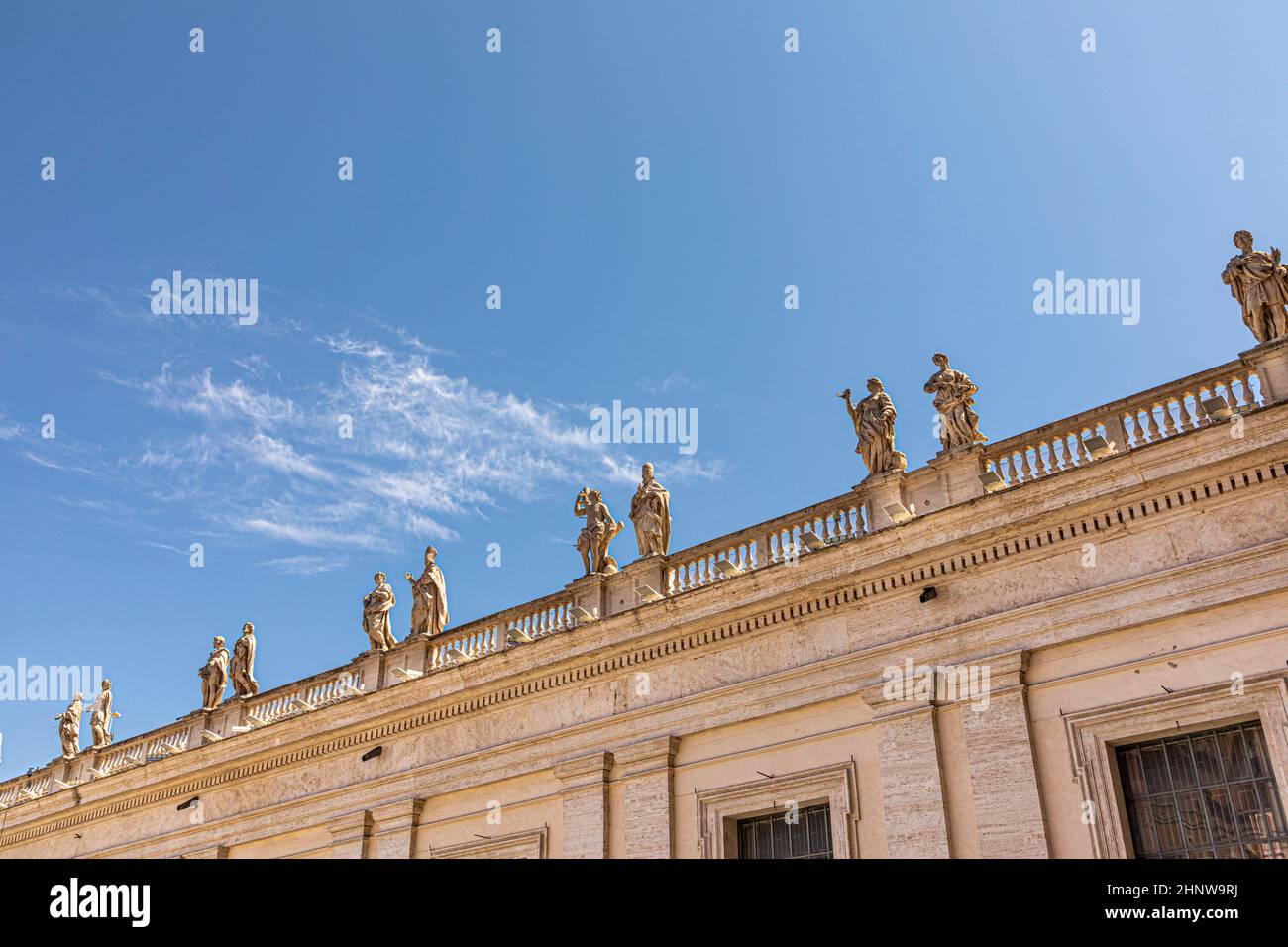 the apostles as statues at the balcony of st. Peters colonnades in the ...