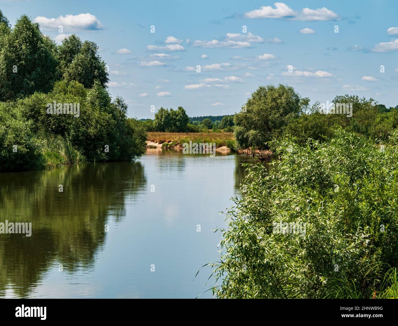 The water surface of the river against the blue sky. Water stream ...