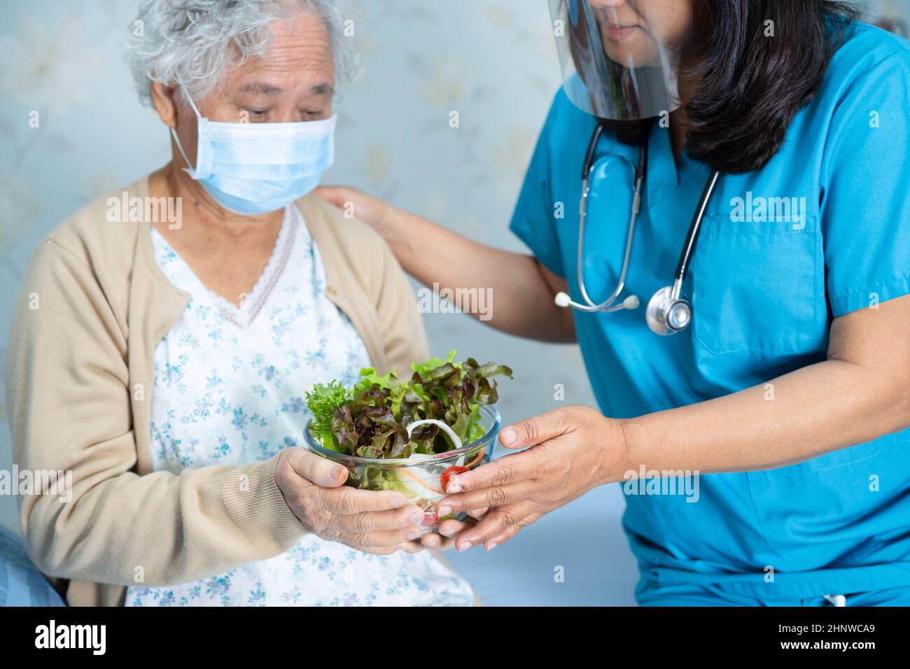 Asian senior or elderly old lady woman patient eating breakfast ...