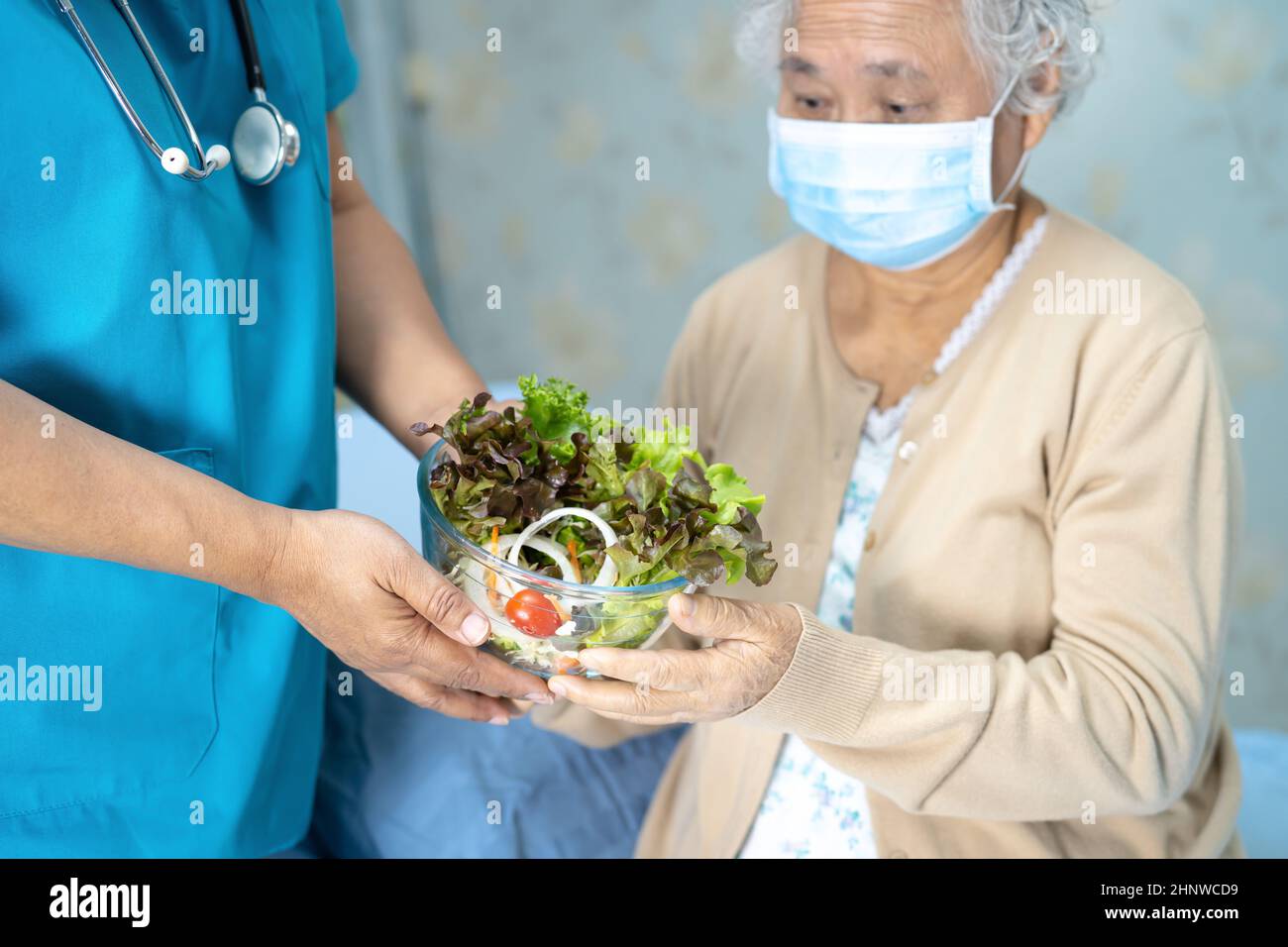 Asian senior or elderly old lady woman patient eating breakfast ...