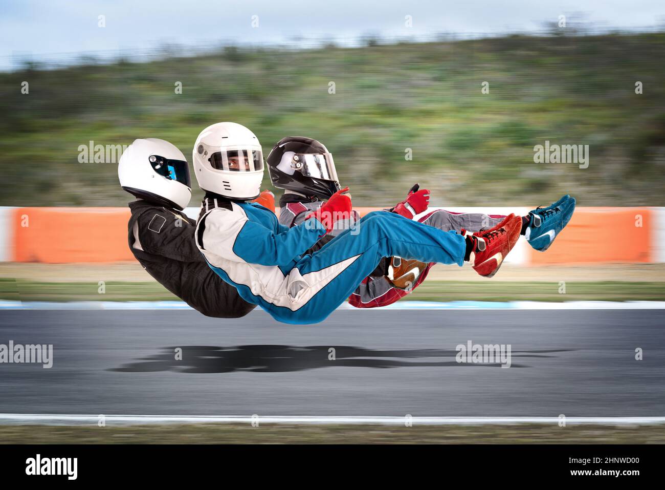 Concept image of racing drivers in racing position with complete gear ...