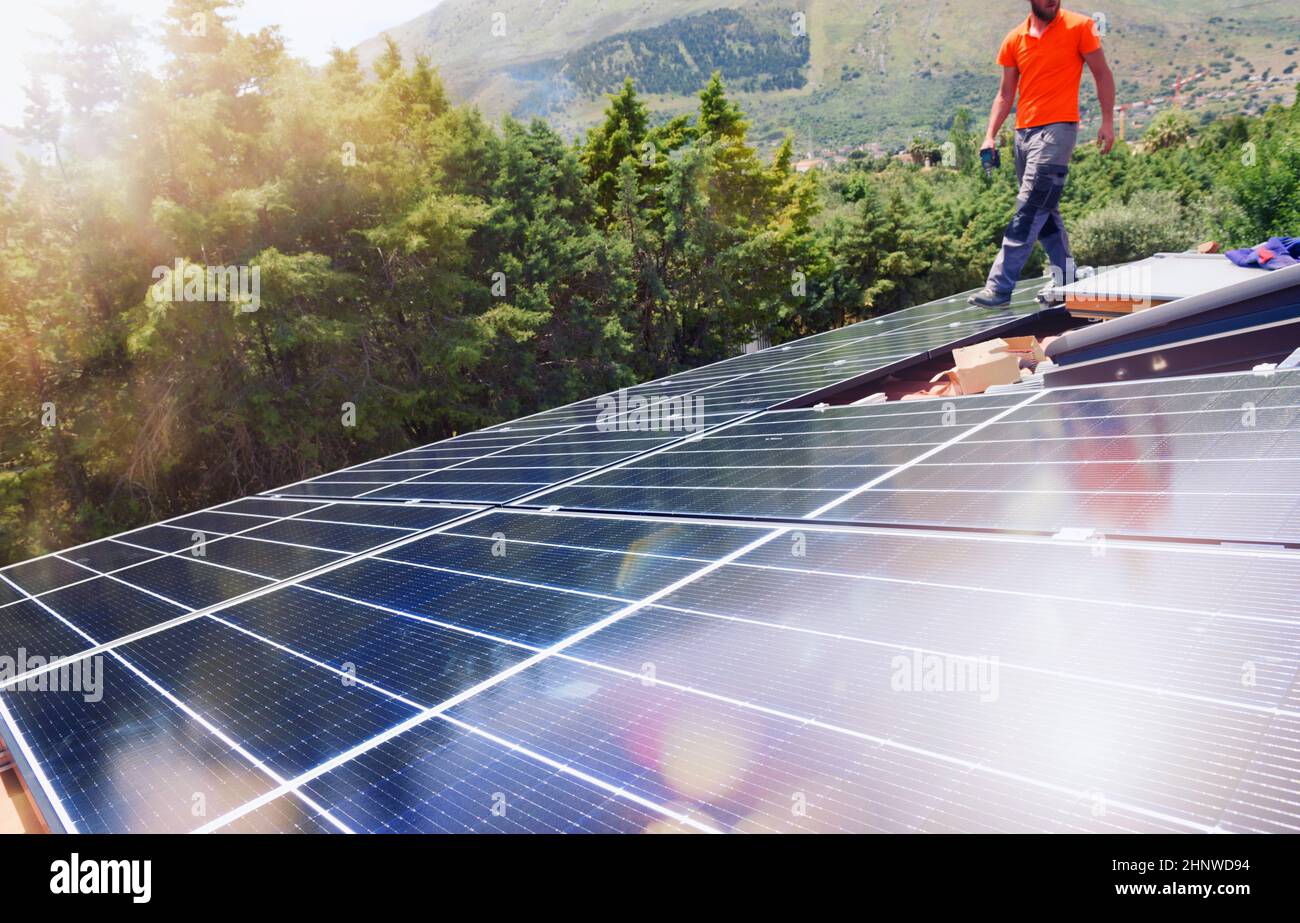 Renewable energy with solar panel on the roof Stock Photo - Alamy