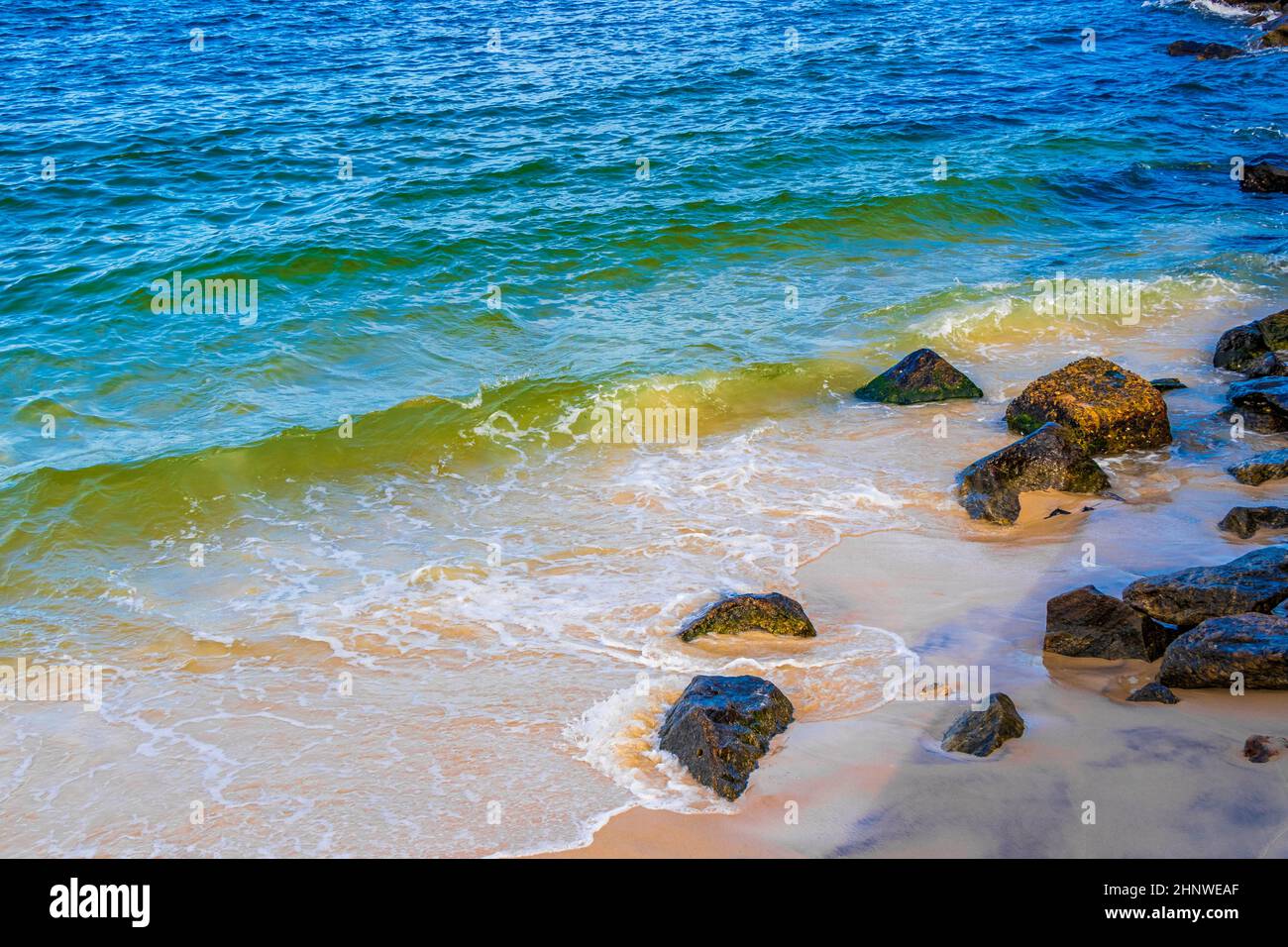 Flamengo Beach blue water seascape rocks boulders and waves at ...
