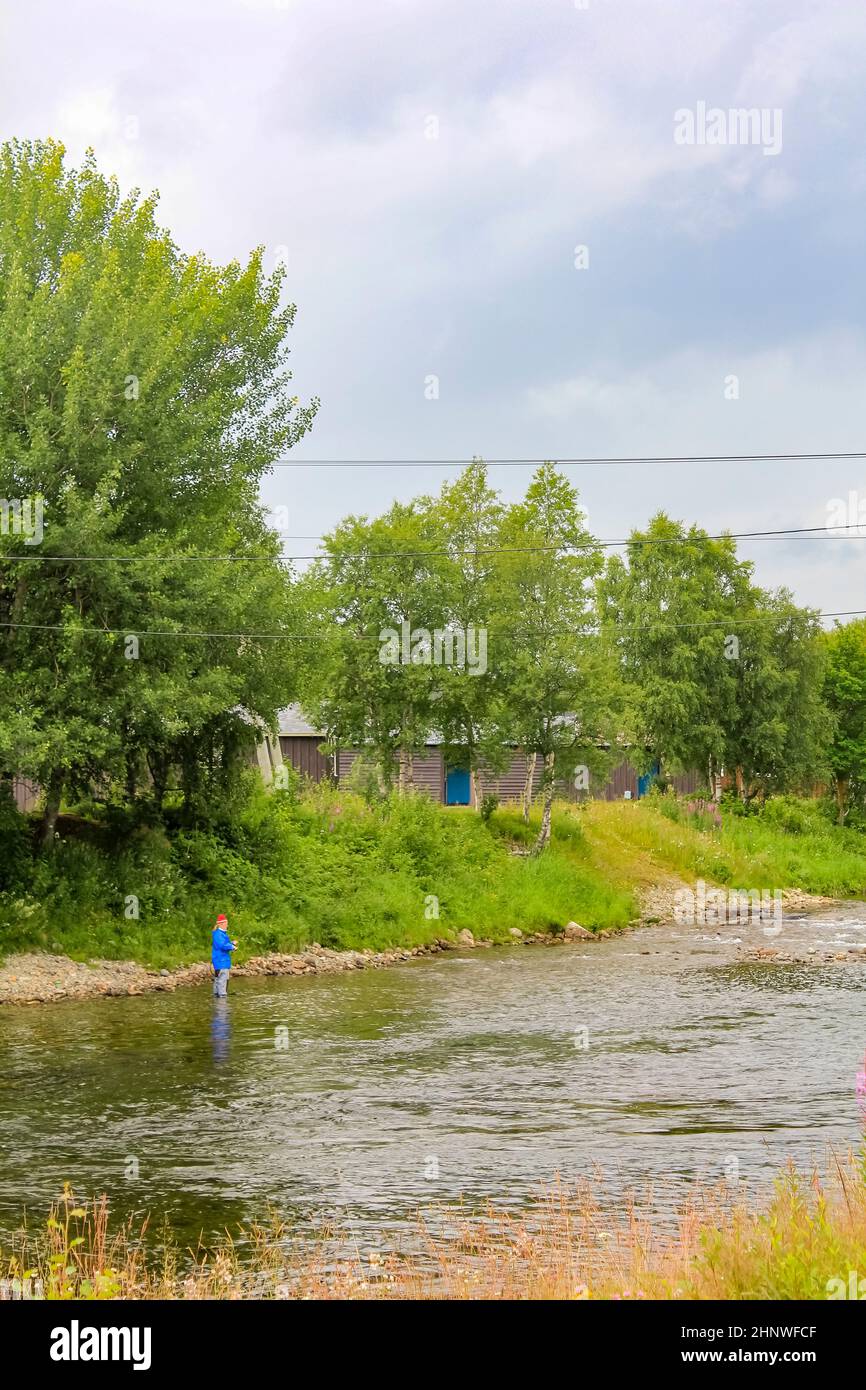 Woman fishing in the river in Ulsåk, Hemsedal, Viken, Buskerud, Norway ...