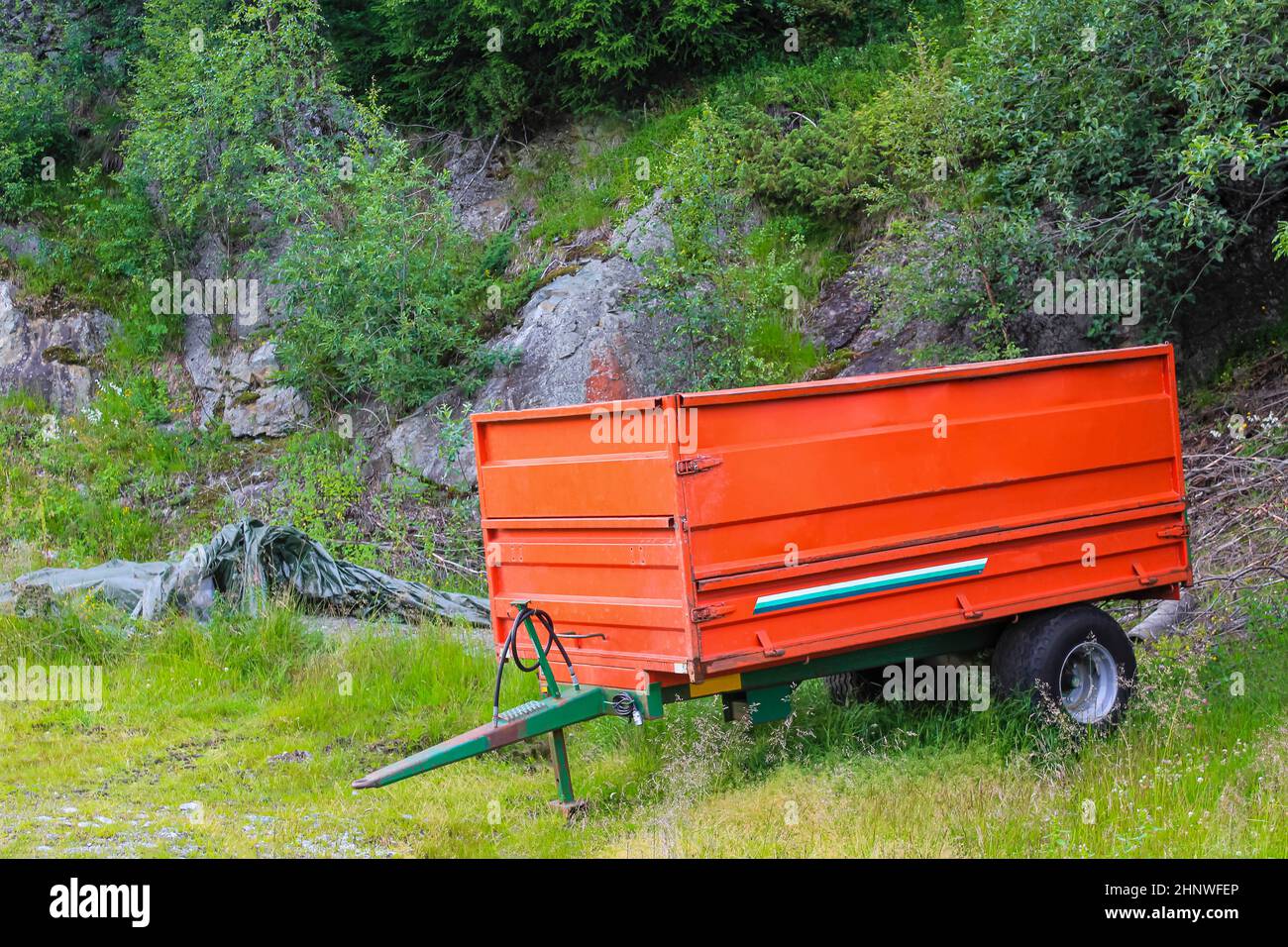 Red tractor trailer in a meadow in Hemsedal, Norway Stock Photo - Alamy