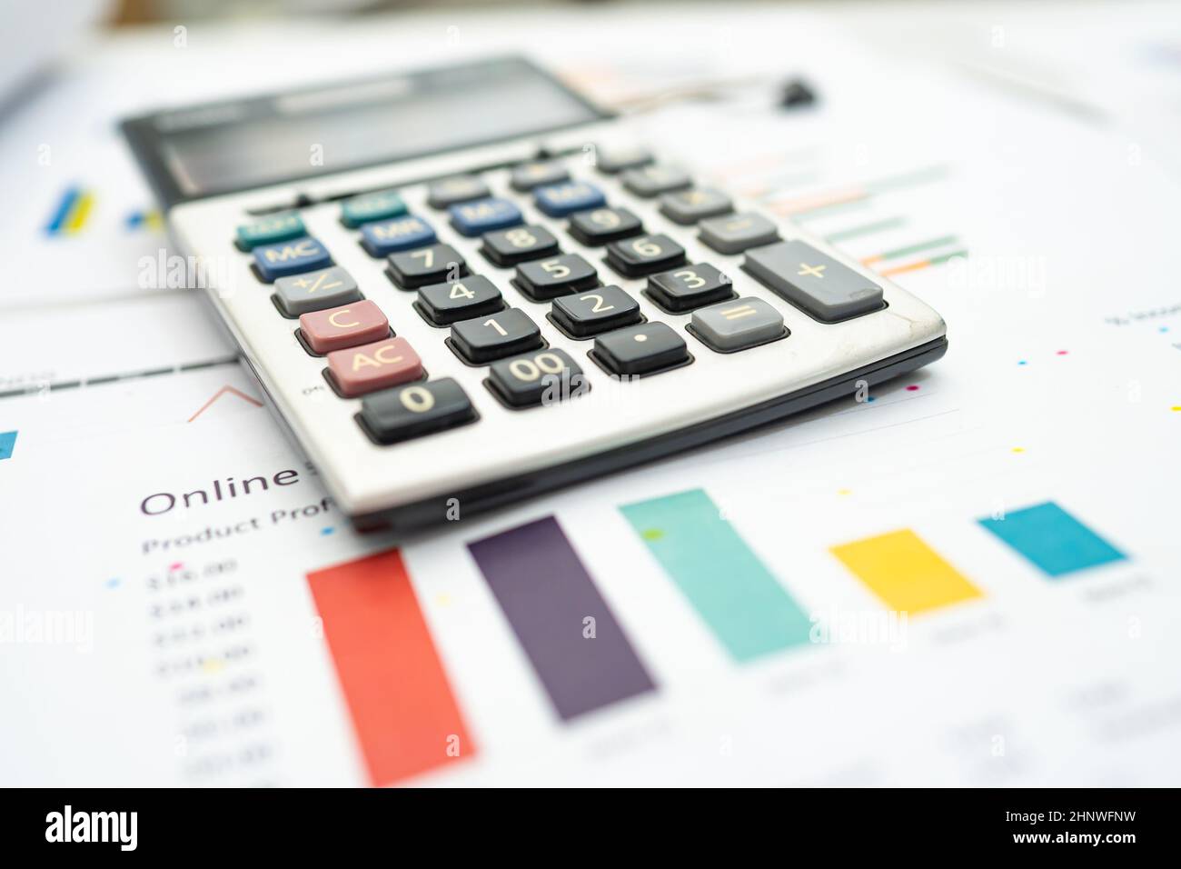 Calculator on chart and graph spreadsheet paper. Finance development ...