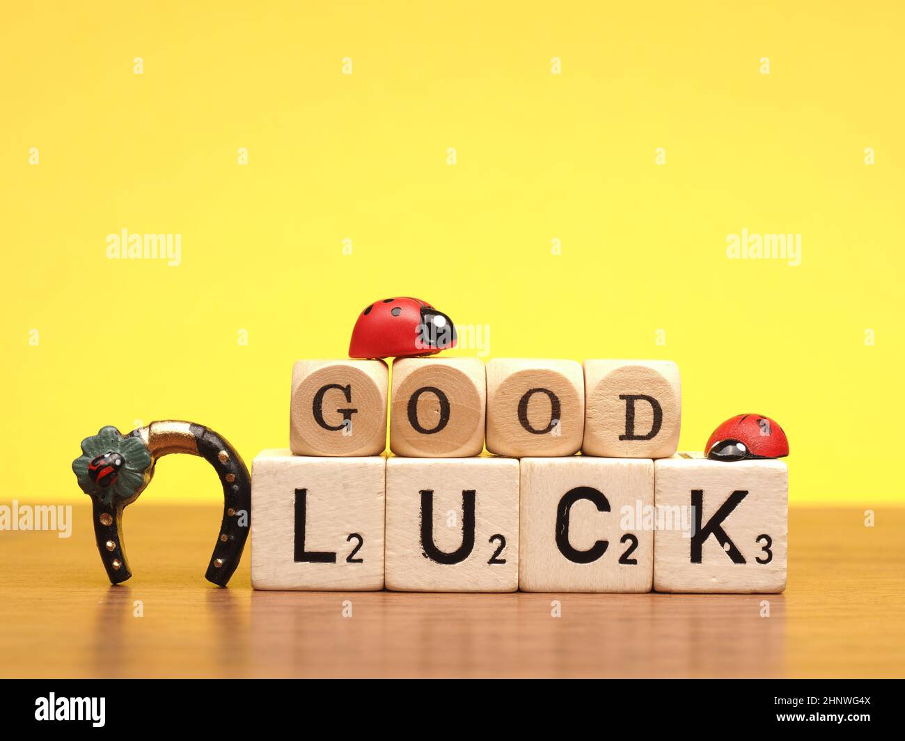 Good luck on wooden blocks and decoration on a yellow background, New ...