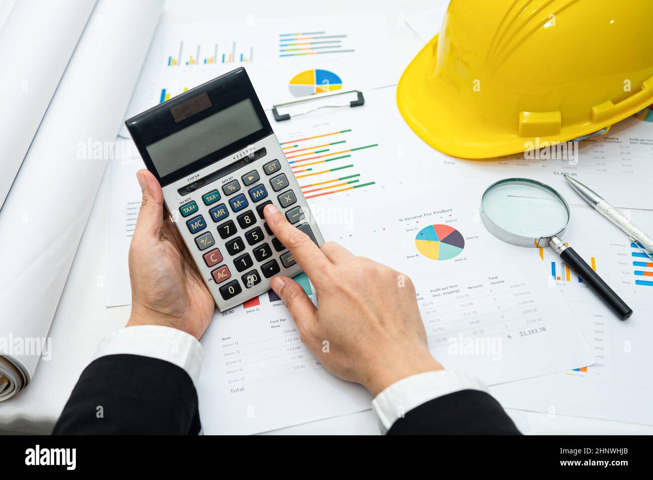 Architect or engineer working project accounting with graph with tools ...