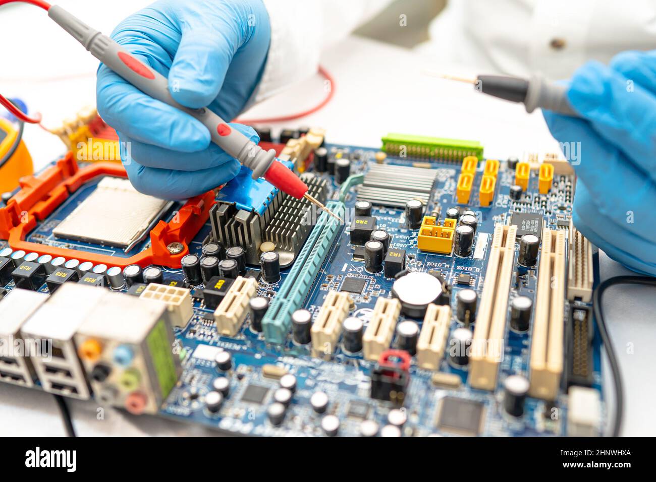 Technician repairing micro circuit main board computer electronic ...
