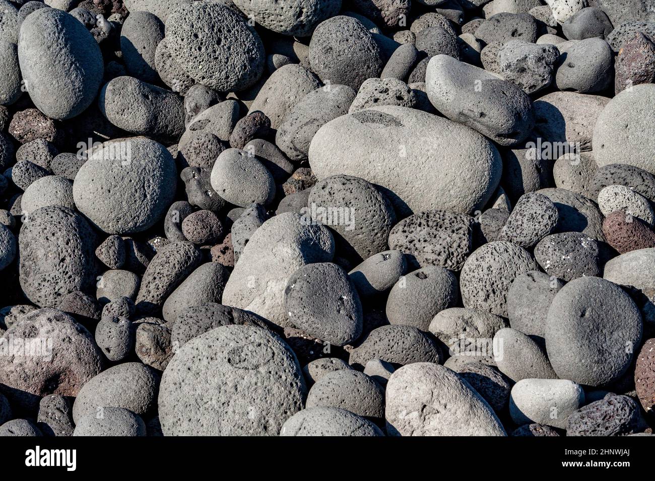 volcanic stone formation at the beach formed by seawater Stock Photo ...