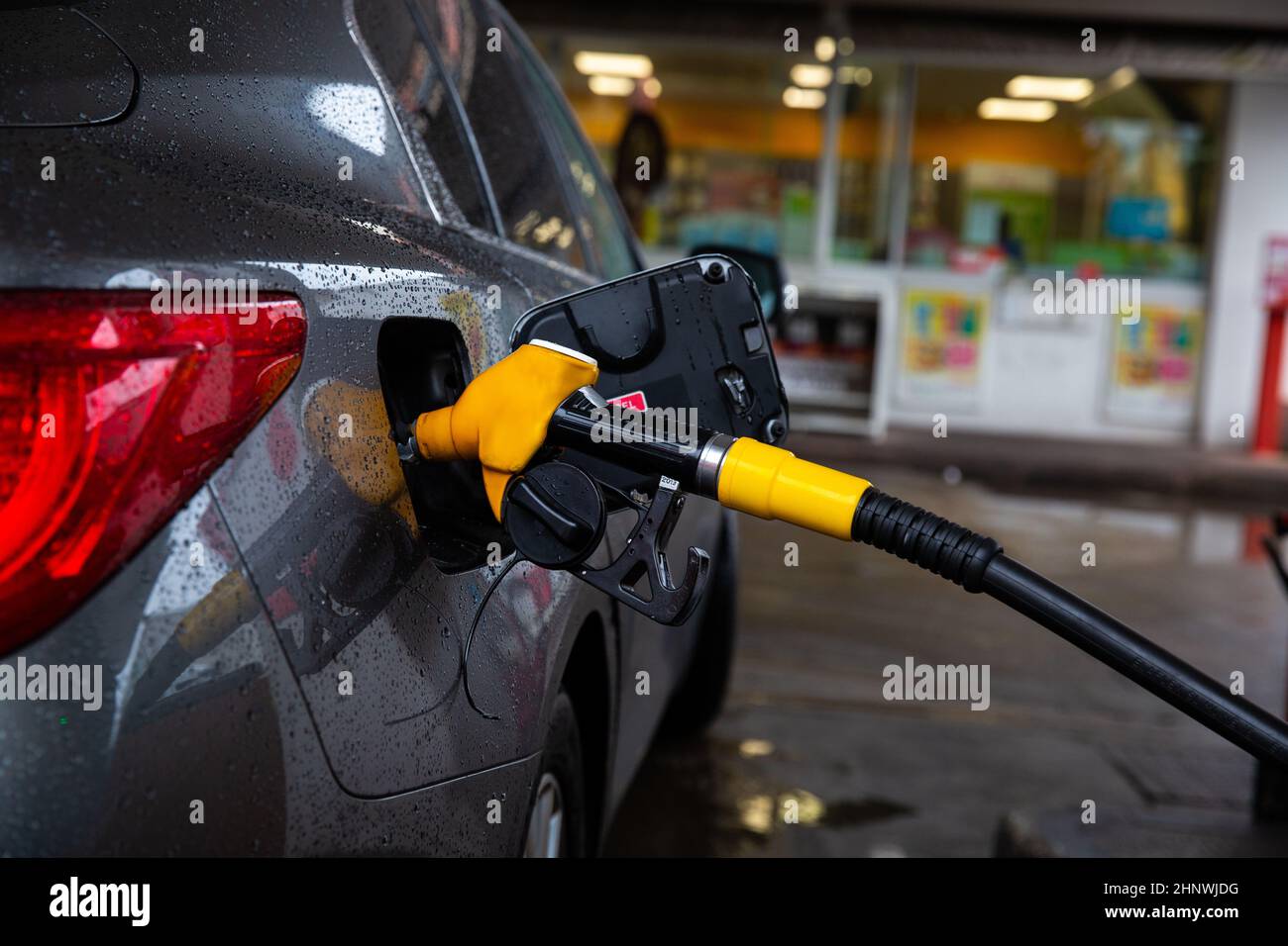 Refueling refilling car vehicle with fuel at refuel fuel gas pump ...