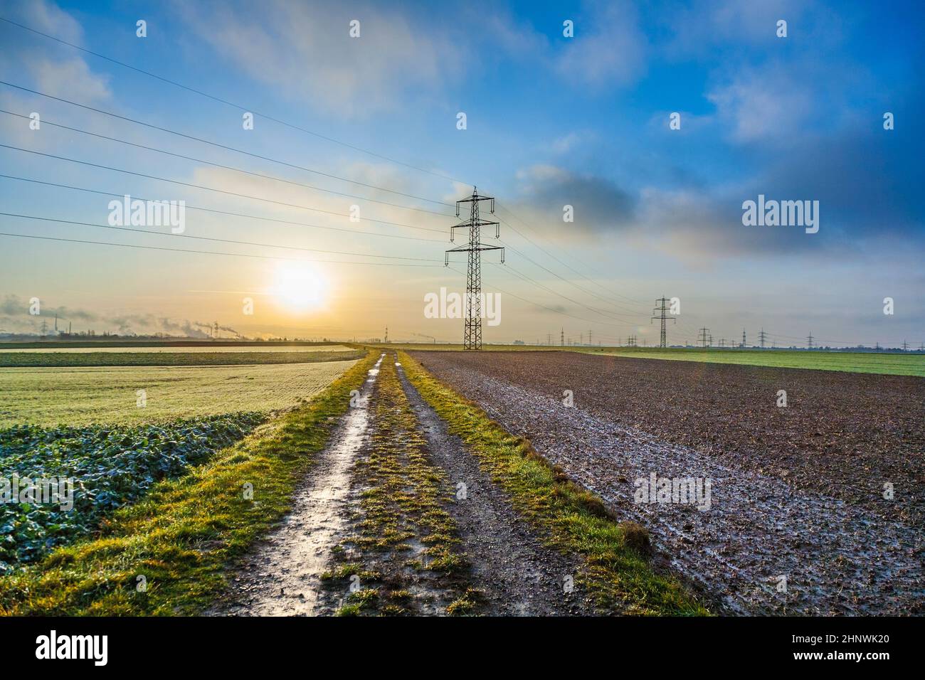 electrical tower in landscape with dark clouds Stock Photo - Alamy