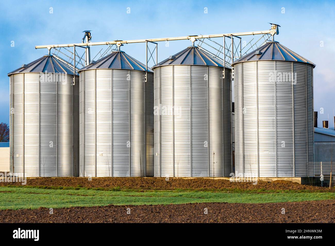 Silo in beautiful landscape with dramatical light placed in plouged ...