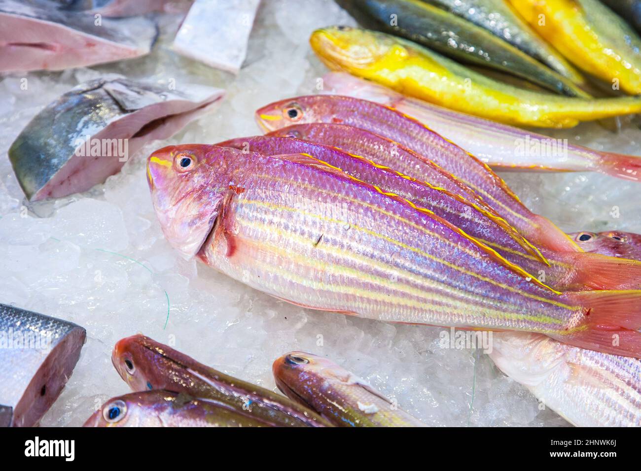 whole fresh fishes are offered in the fish market in asia Stock Photo ...