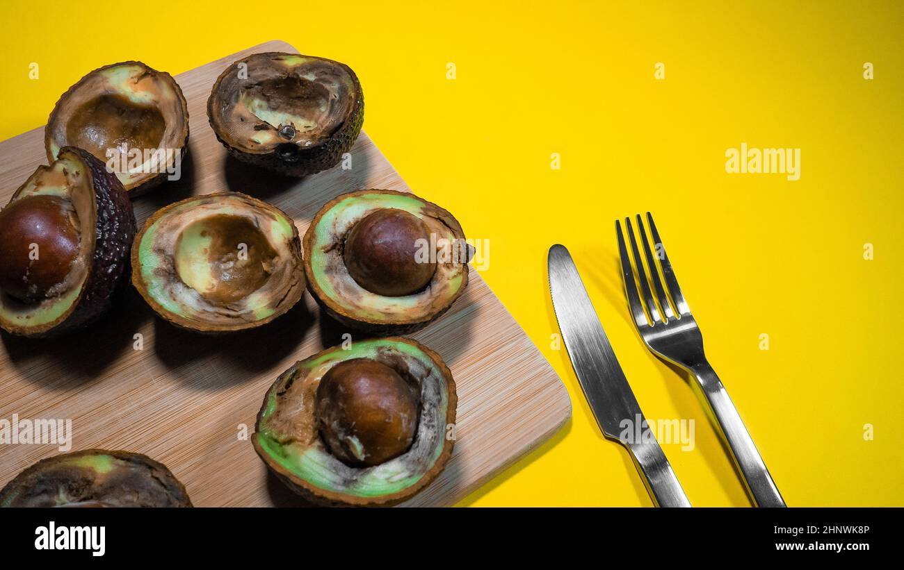 Halfs rotten avocado. Unhelthy food Concept. Close up bad avocado on ...