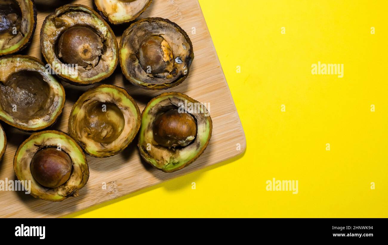 Many Bad Avocado on a yellow background. Creative composition of bad ...