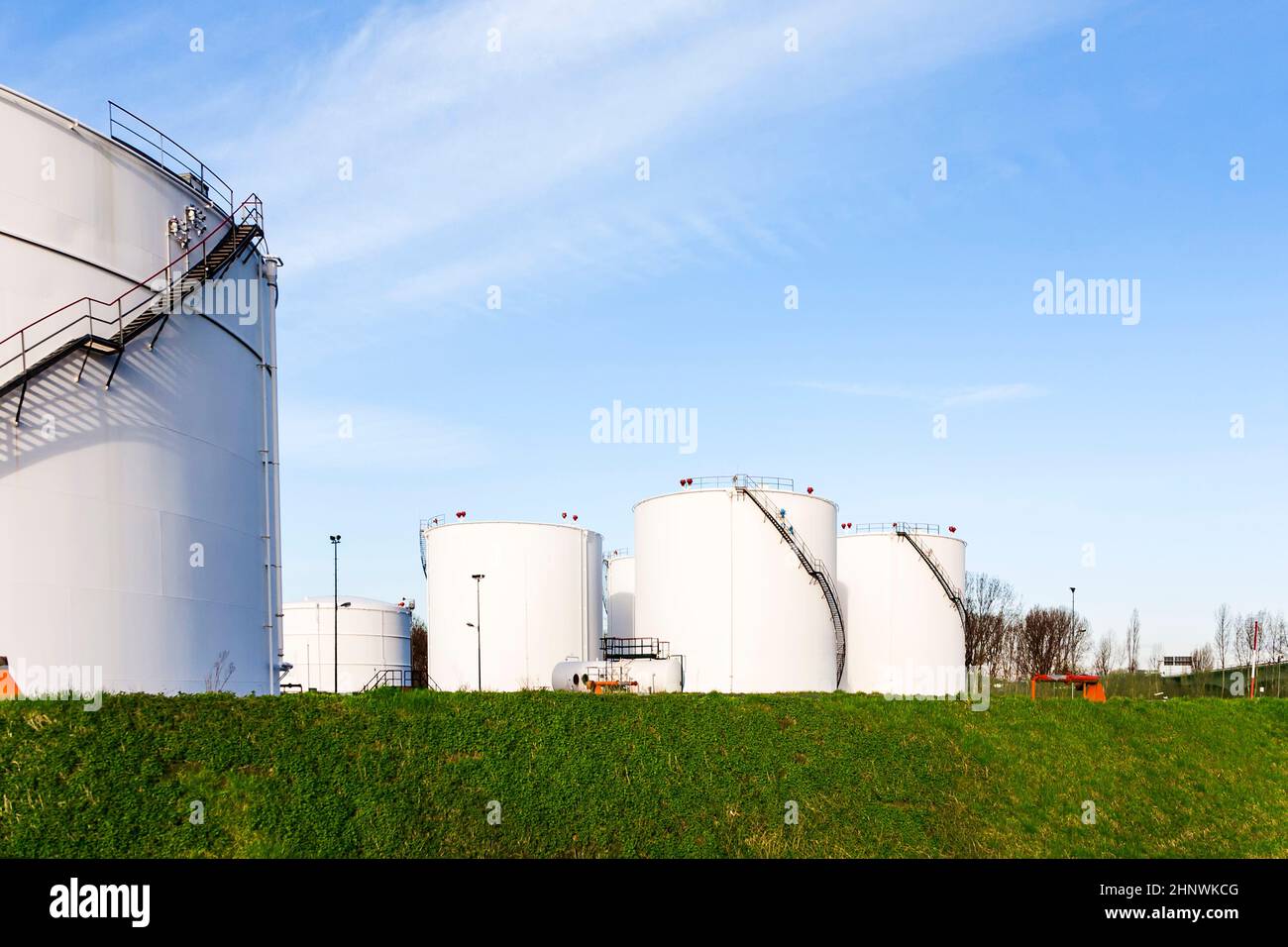 white tanks for petrol and oil in tank farm with blue sky Stock Photo ...