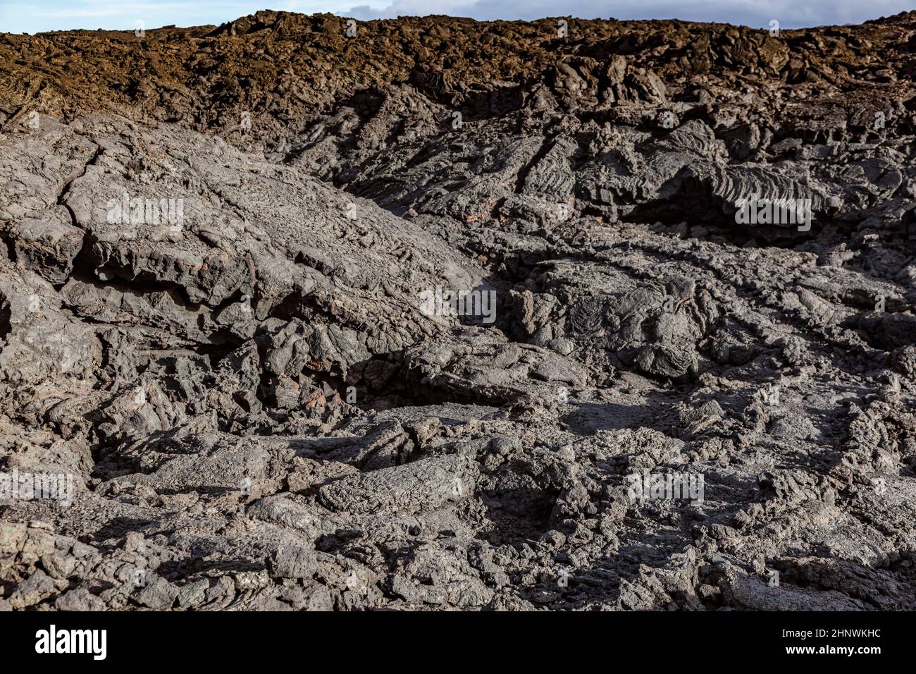 Stones of volcanic flow give a beautiful natural structure Stock Photo ...