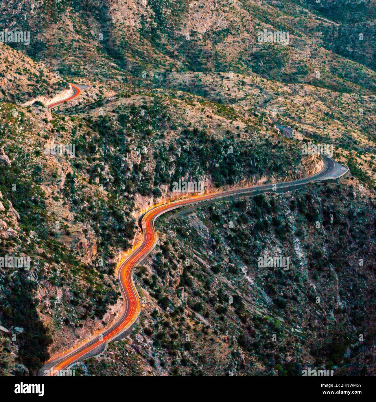 headlights of car in winding road in the desert near Tuscon, Arizona ... headlights of car in winding road in the desert near Tuscon, Arizona ...