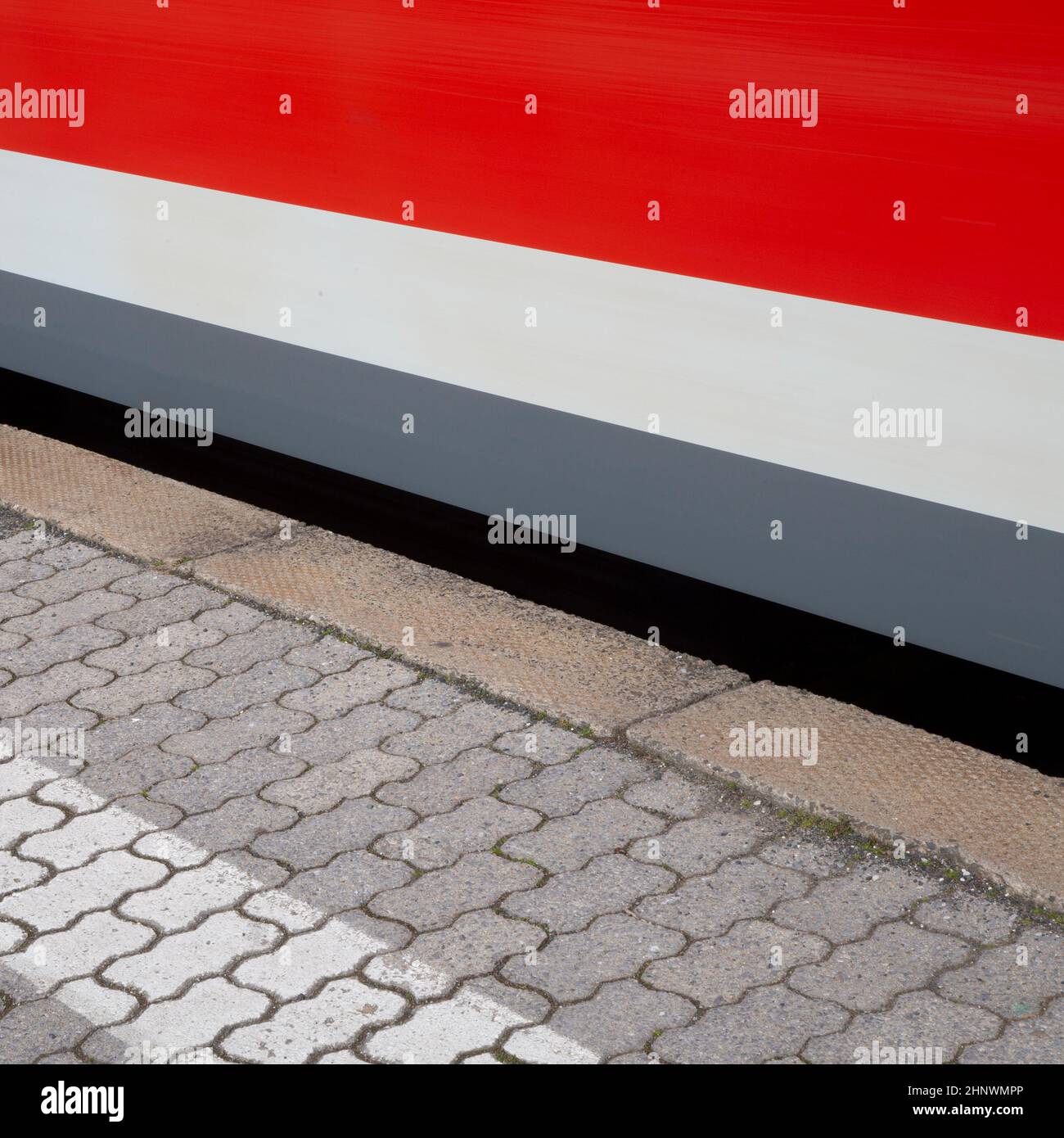 detail of train with blurred motion and platform as symbol for ...