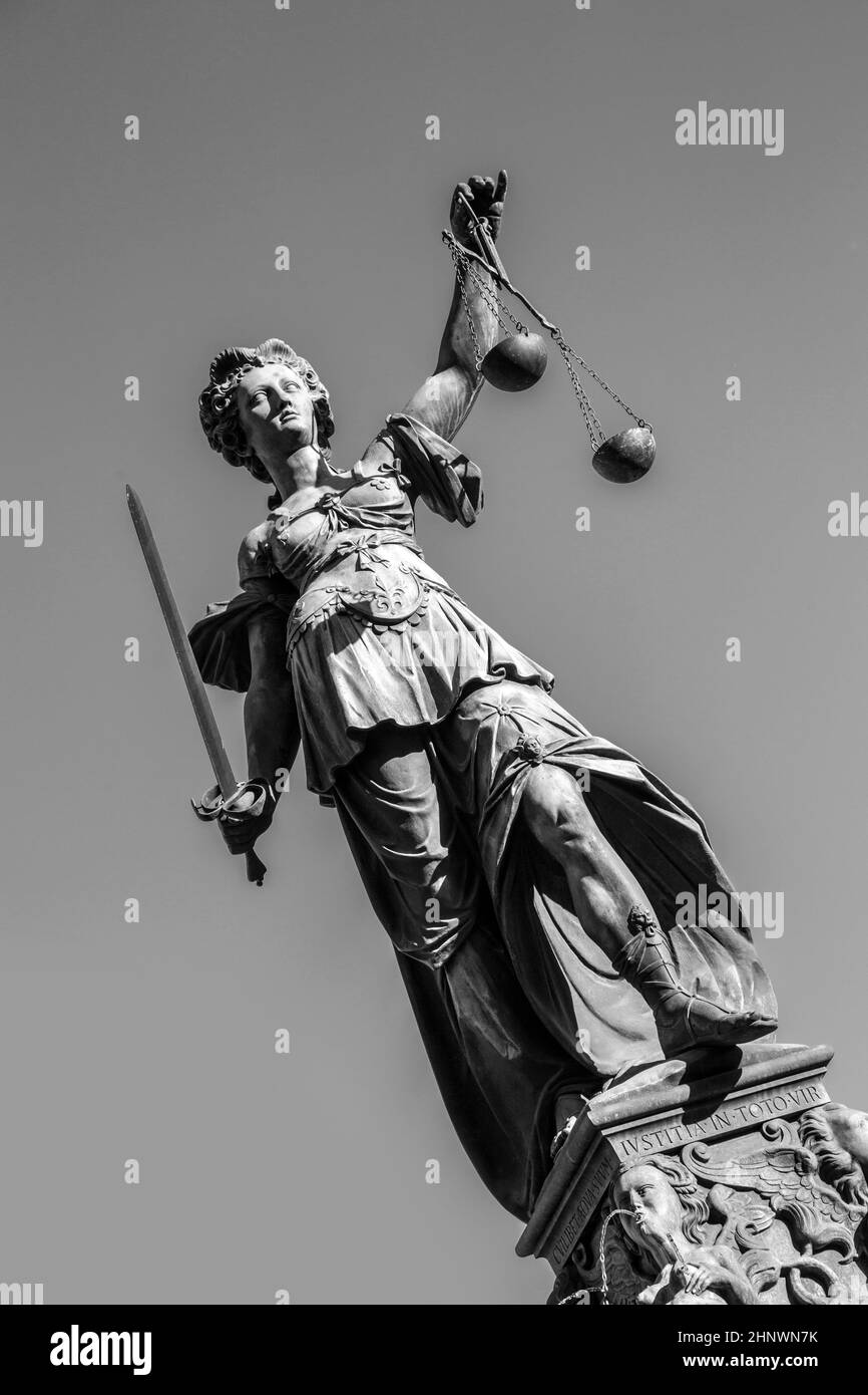 Justitia - Lady Justice sculpture on the Roemerberg square under blue ...