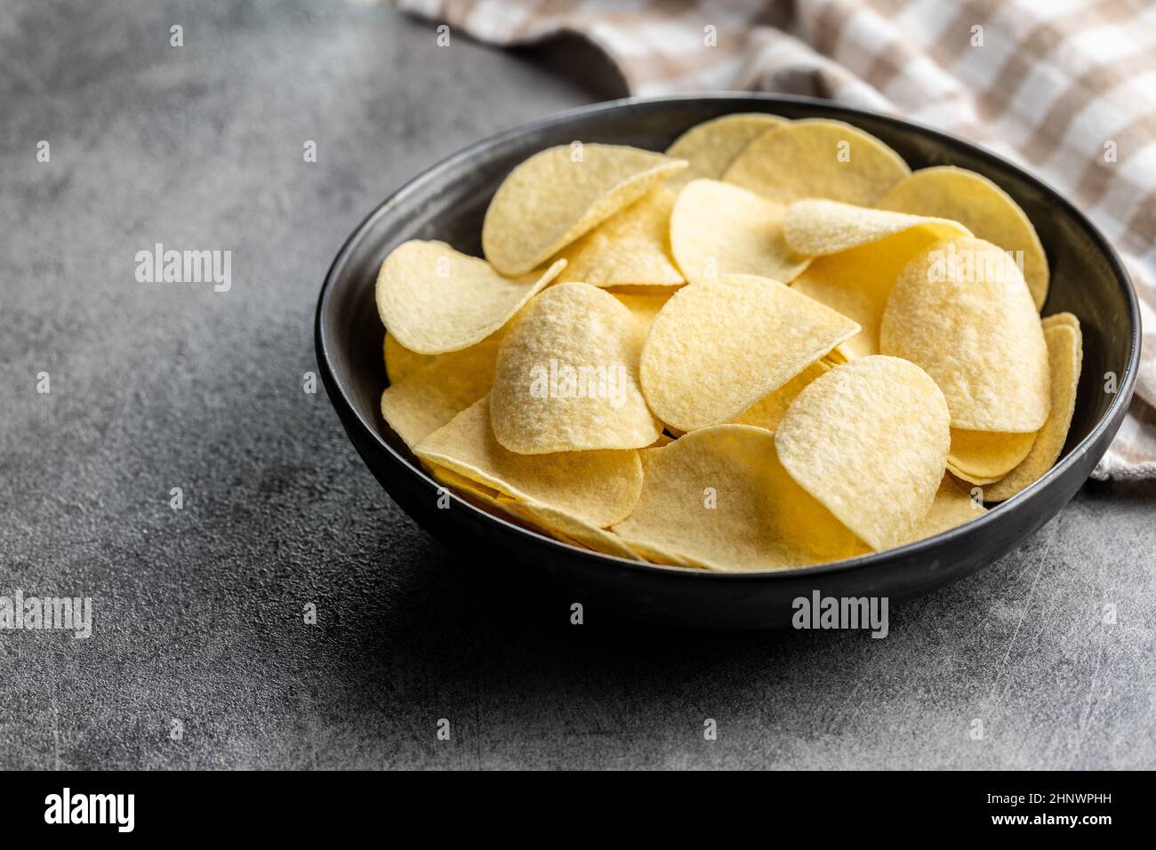 Crunchy potato chips. Potato crisps on plate Stock Photo - Alamy