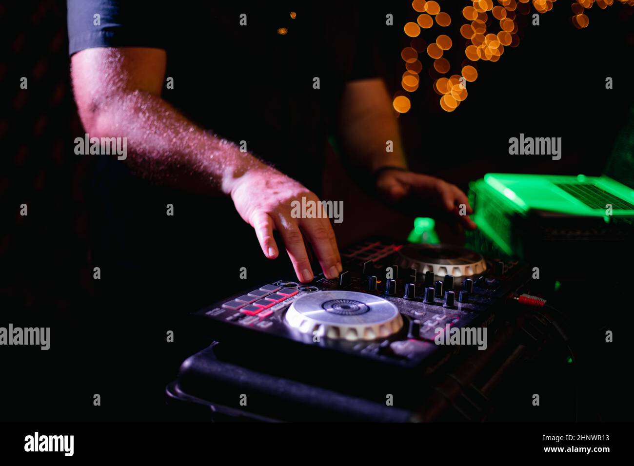 Dj playing music. Sound mixer panel and cd players turntables with ...