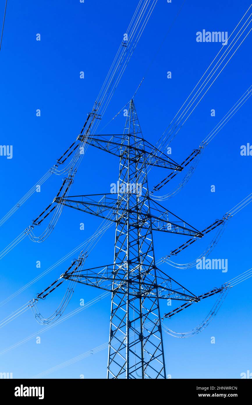 electric pylon under clear blue sky to transport electricity Stock ...