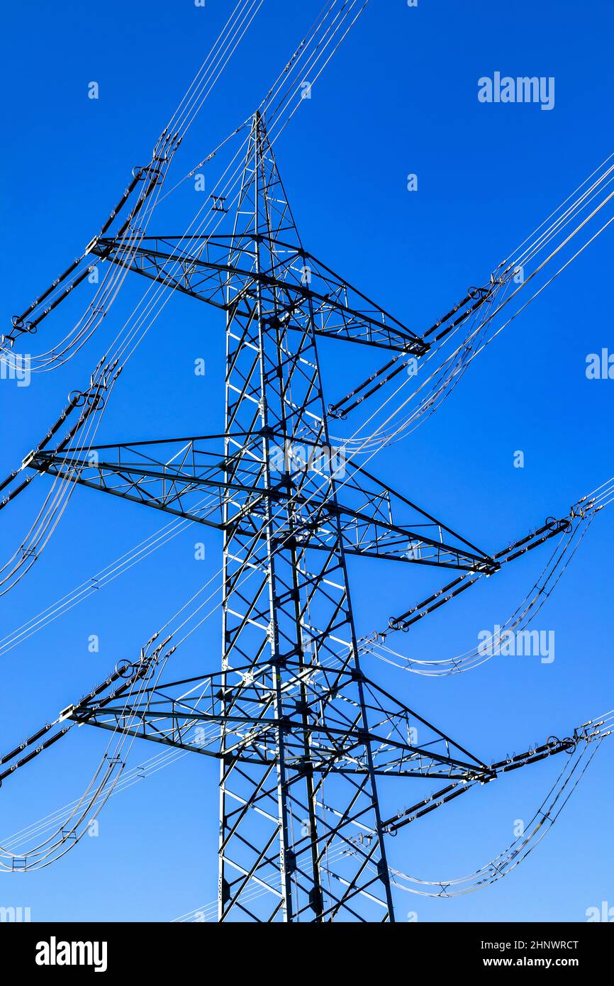 electric pylon under clear blue sky to transport electricity Stock ...