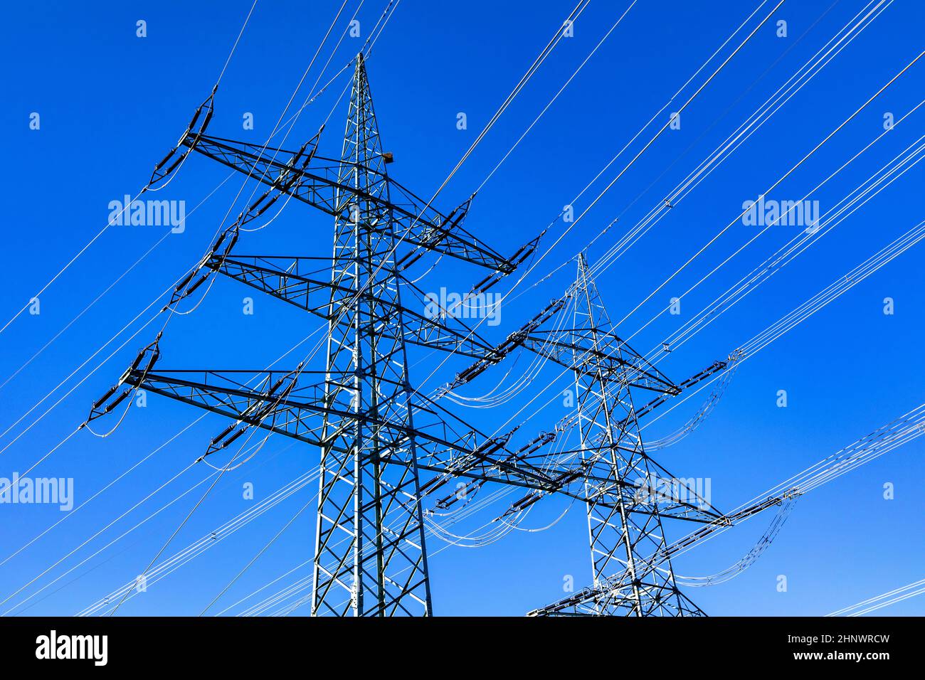 electric pylon under clear blue sky to transport electricity Stock ...