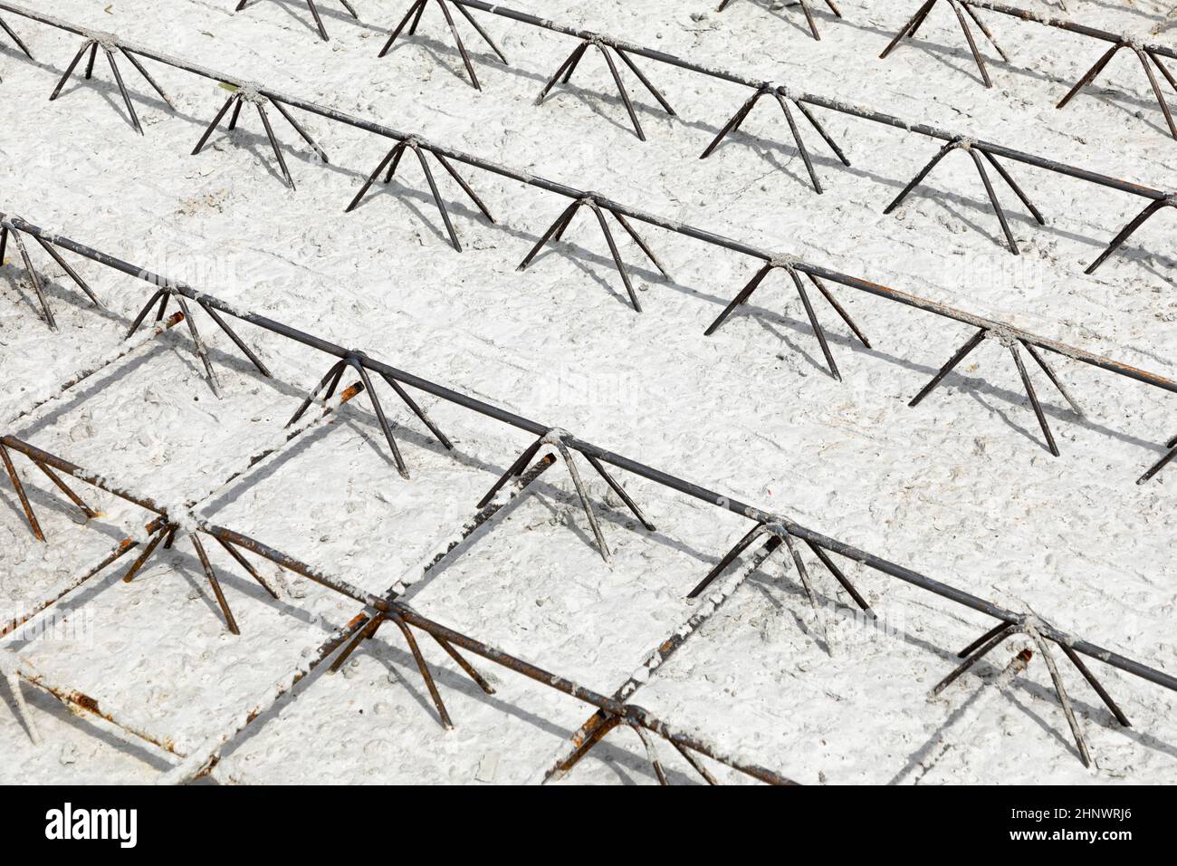 detail of base plate with iron rod in concrete Stock Photo - Alamy