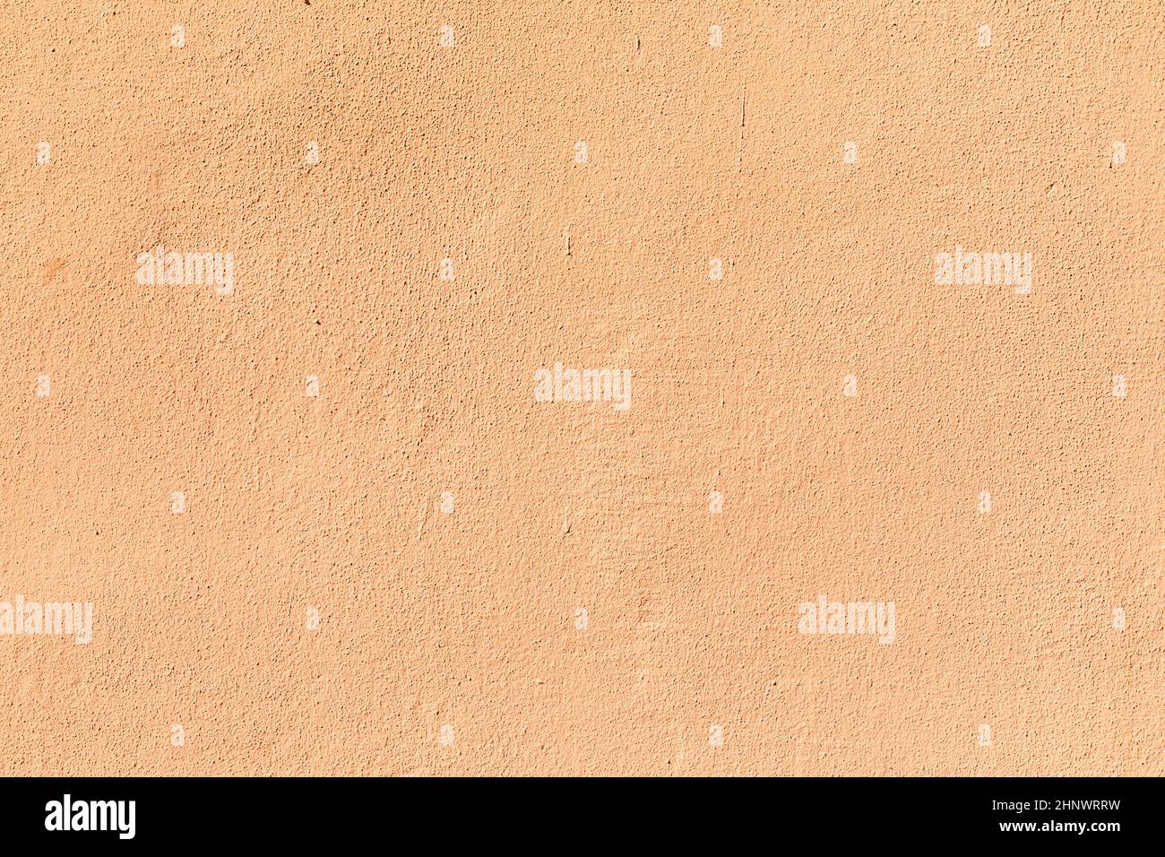 pattern of structured and orange painted house wall in mediterranean ...