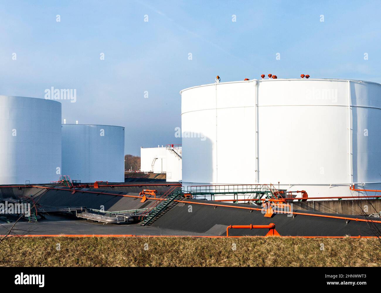 white tanks in tank farm with blue sky Stock Photo - Alamy