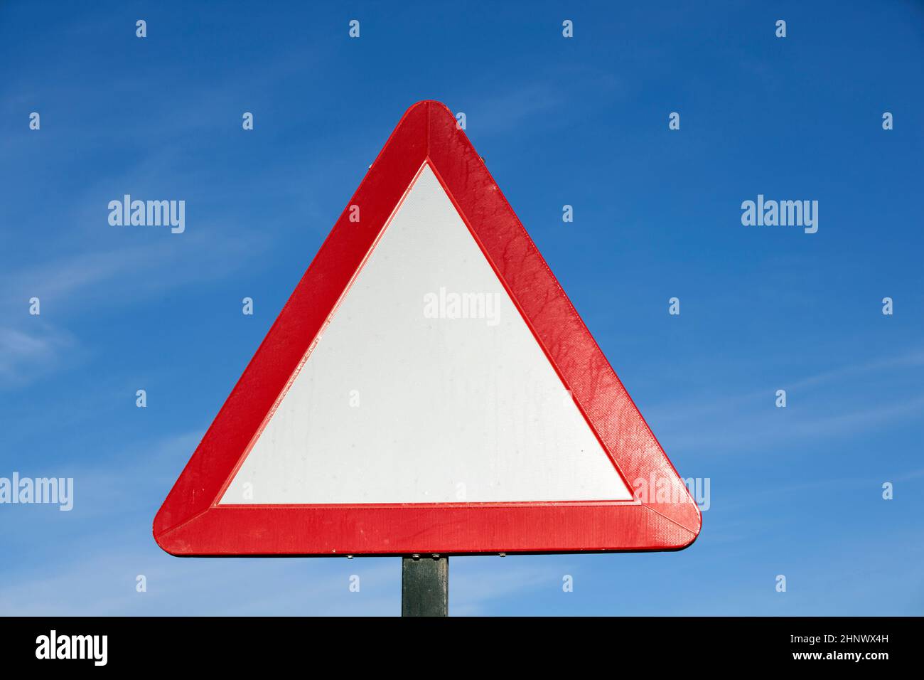 street sign attention under clear blue sky Stock Photo - Alamy