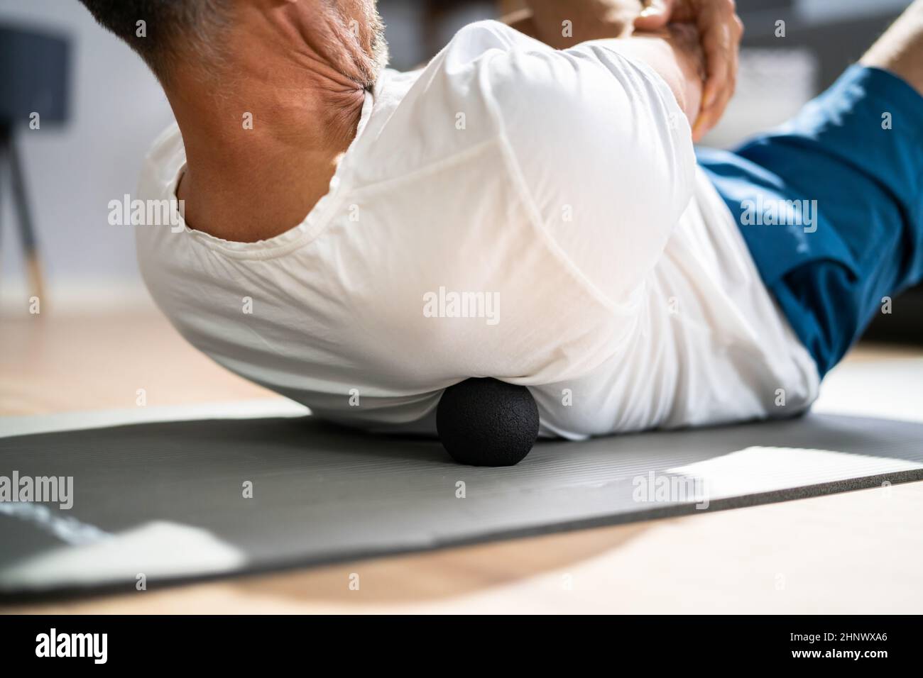 Back Trigger Point Massage Using Foam Ball Myofascial Release Stock ...